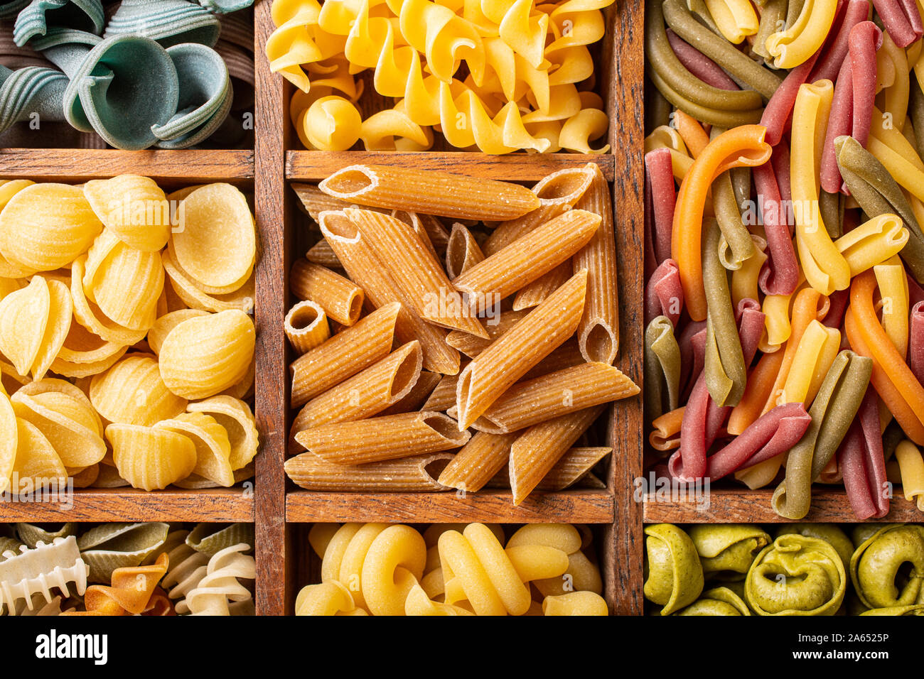 Assorted colorful italian pasta in wooden box Stock Photo - Alamy