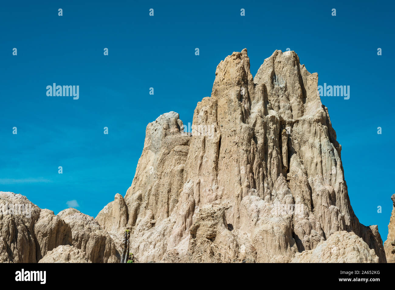 sharp edge sand rock by bright sunny day in Moon Valley in Bolivia ...