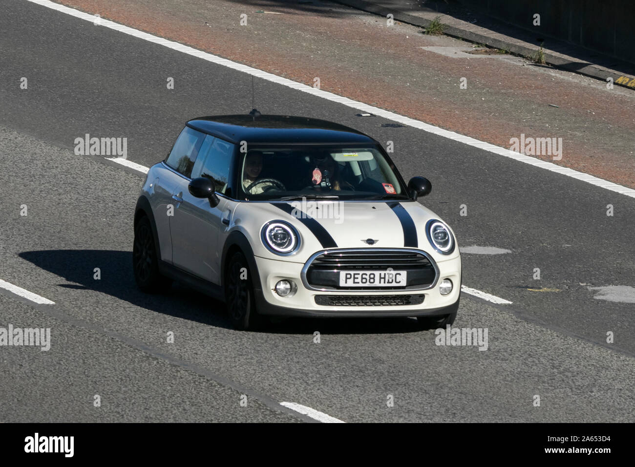 White mini car or vehicle driving travelling hi-res stock photography ...