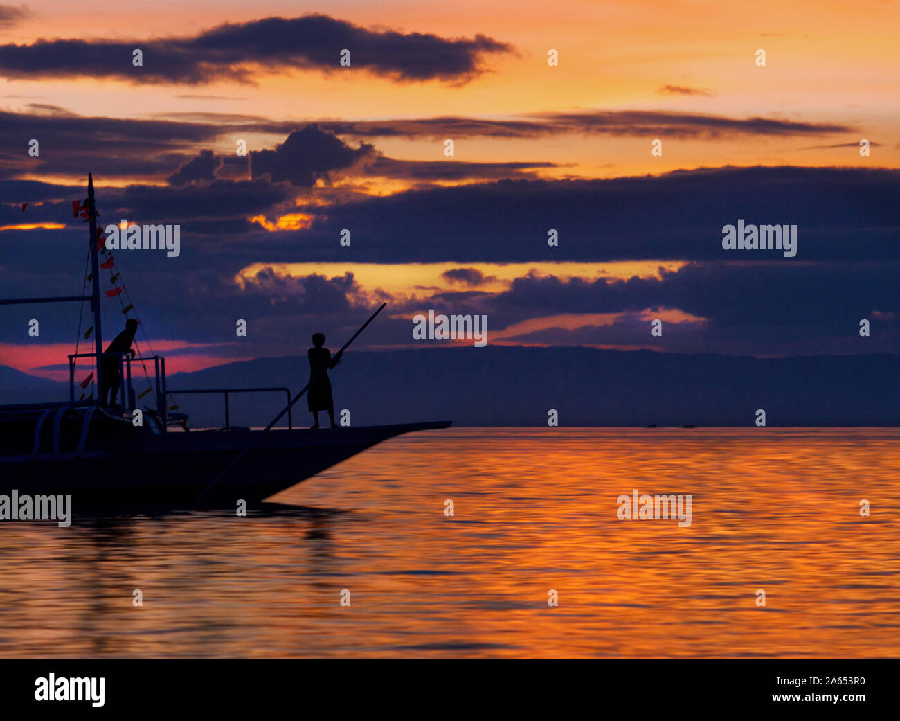 Dramatic sunset in Bohol island, Philippines, people and boat ...
