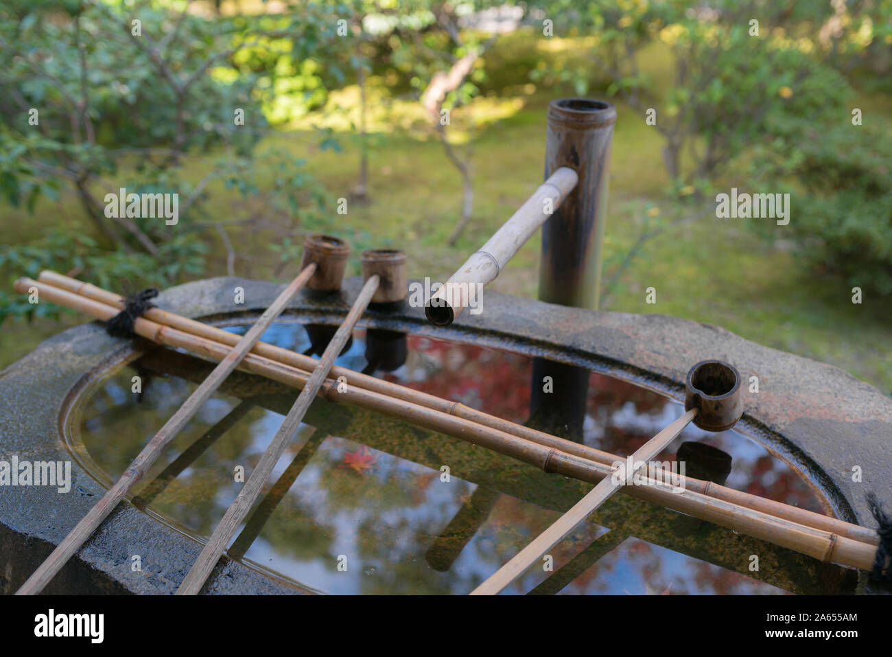 Japanese Basin called tsukubai with Ladles for water in a ritual hand ...