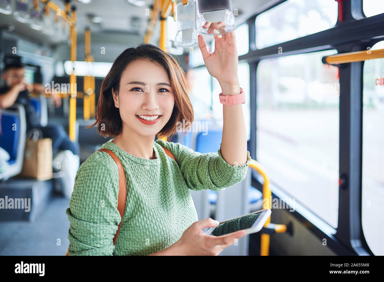 Beautiful young asian woman who see a smart phone in city bus Stock ...