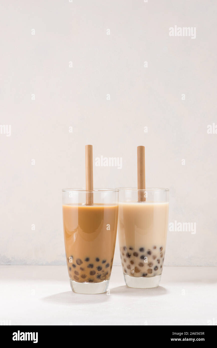 Variety of homemade bubble tea/ boba tea with tapioca pearls on white ...