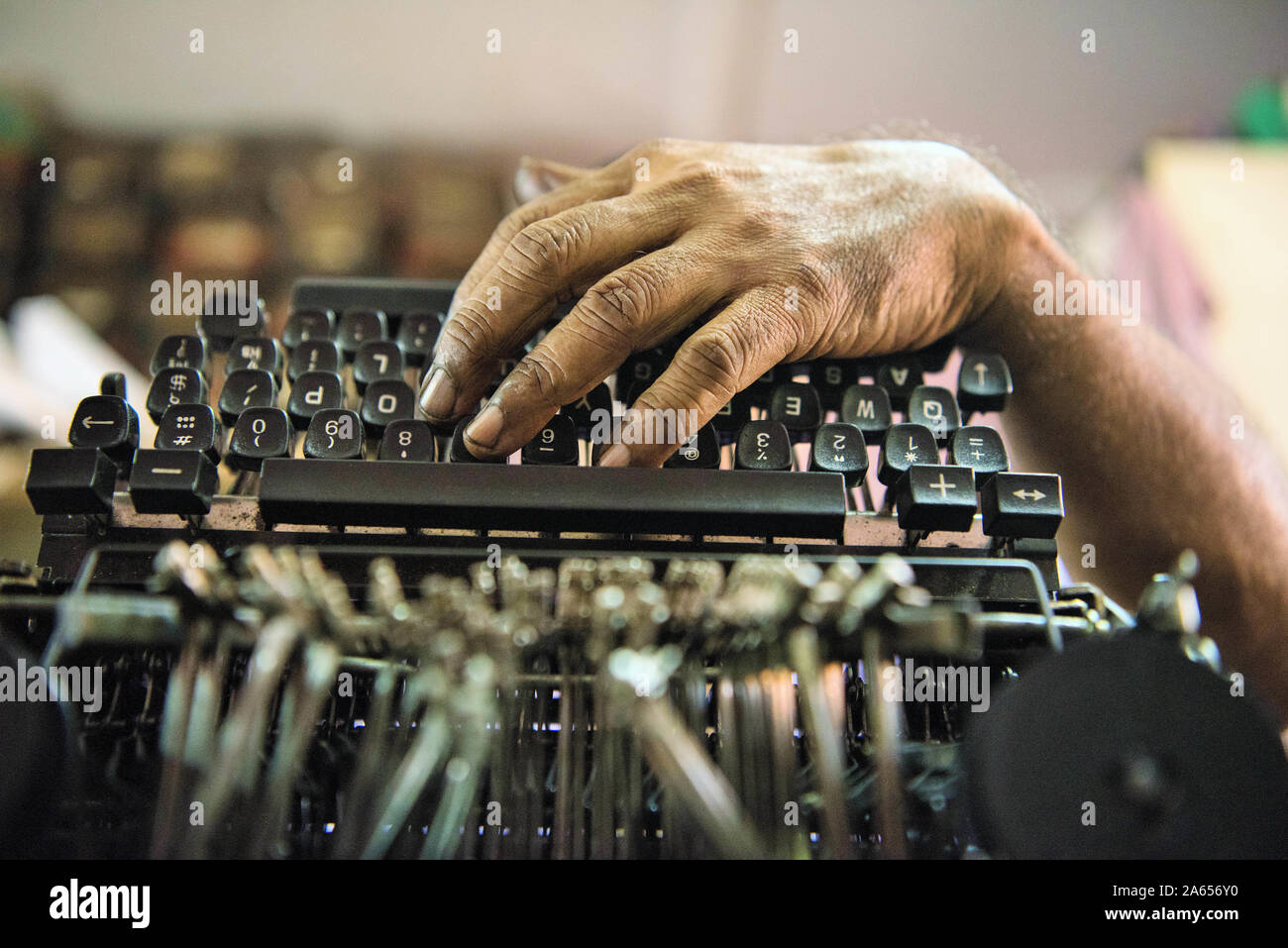 Technician repairing an old manual typewriter, Bombay, Mumbai ...