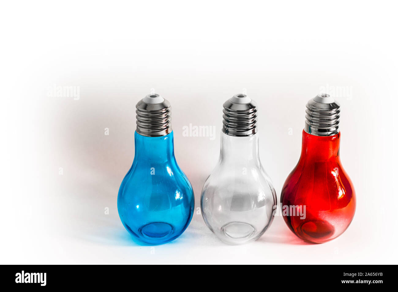 Light bulb shaped cocktail glasses on white background Stock Photo - Alamy
