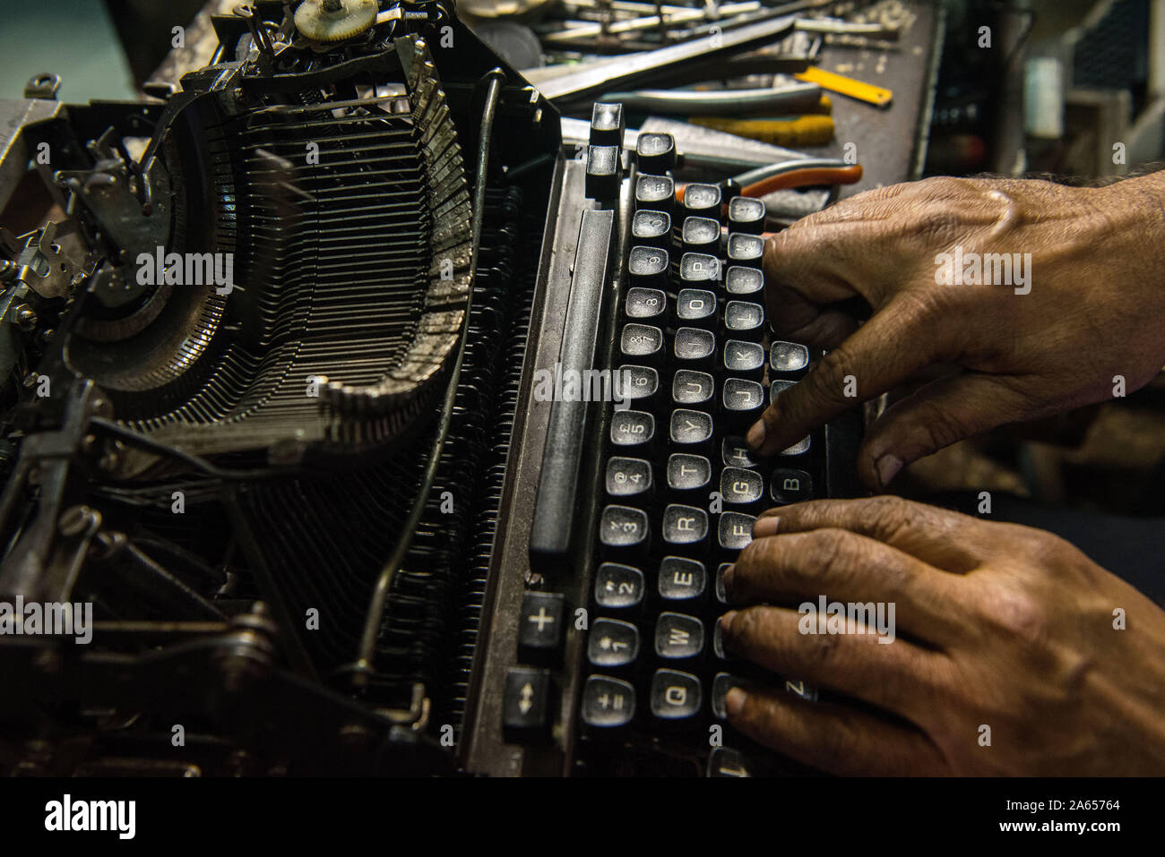 Technician repairing an old manual typewriter, Bombay, Mumbai ...