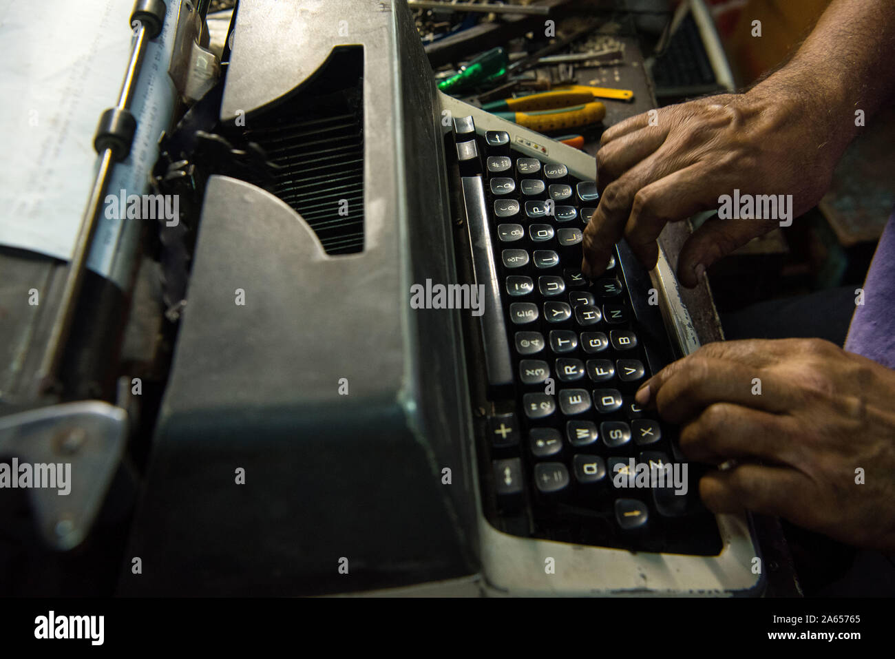 Technician repairing an old manual typewriter, Bombay, Mumbai ...