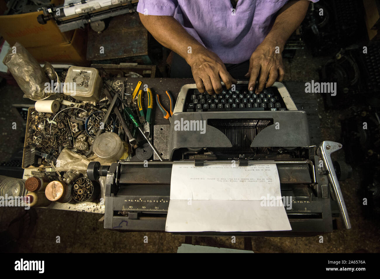 Technician repairing an old manual typewriter, Bombay, Mumbai ...