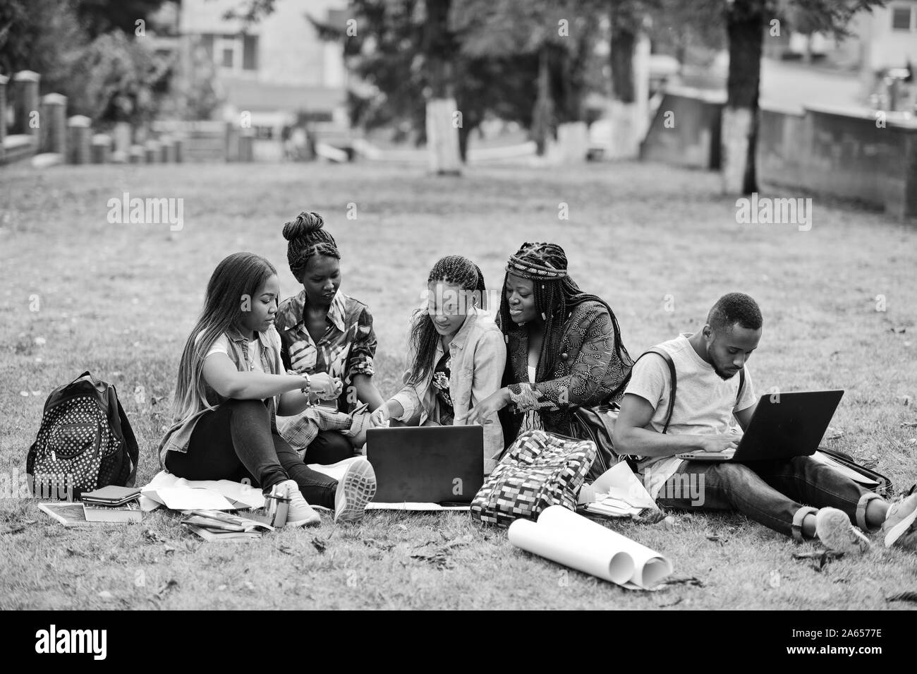 University students sitting on campus Black and White Stock Photos ...