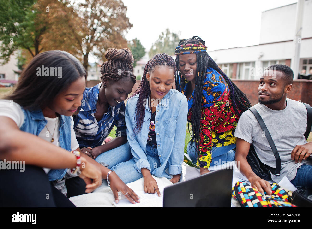 Group of five african college students spending time together on campus ...