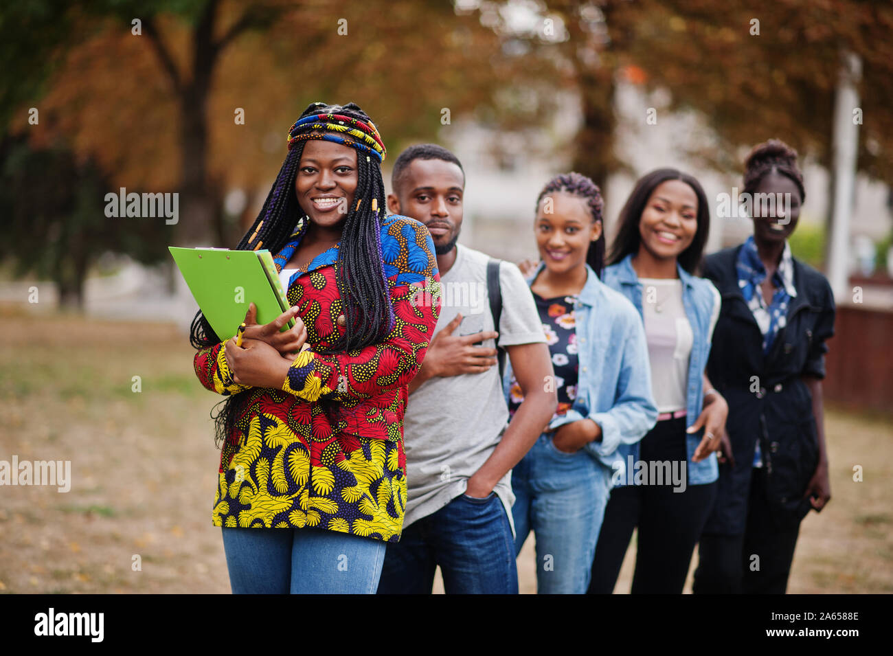Row of group five african college students spending time together on ...