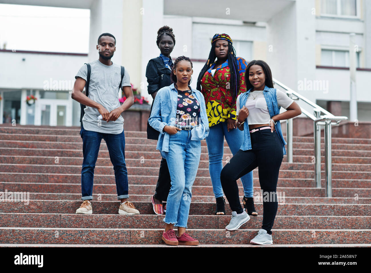Group of five african college students spending time together on campus ...