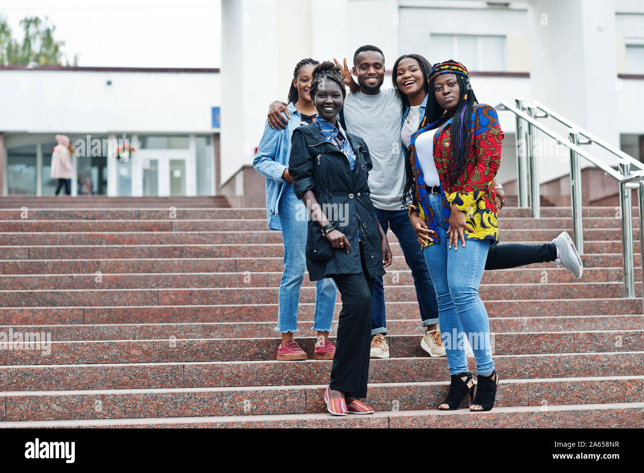 Group of five african college students spending time together on campus ...