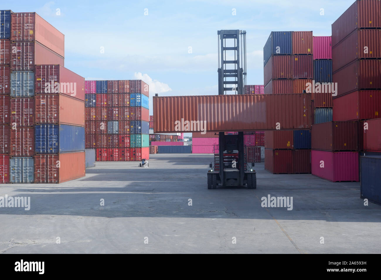 Container handlers in the port for export and import Stock Photo - Alamy