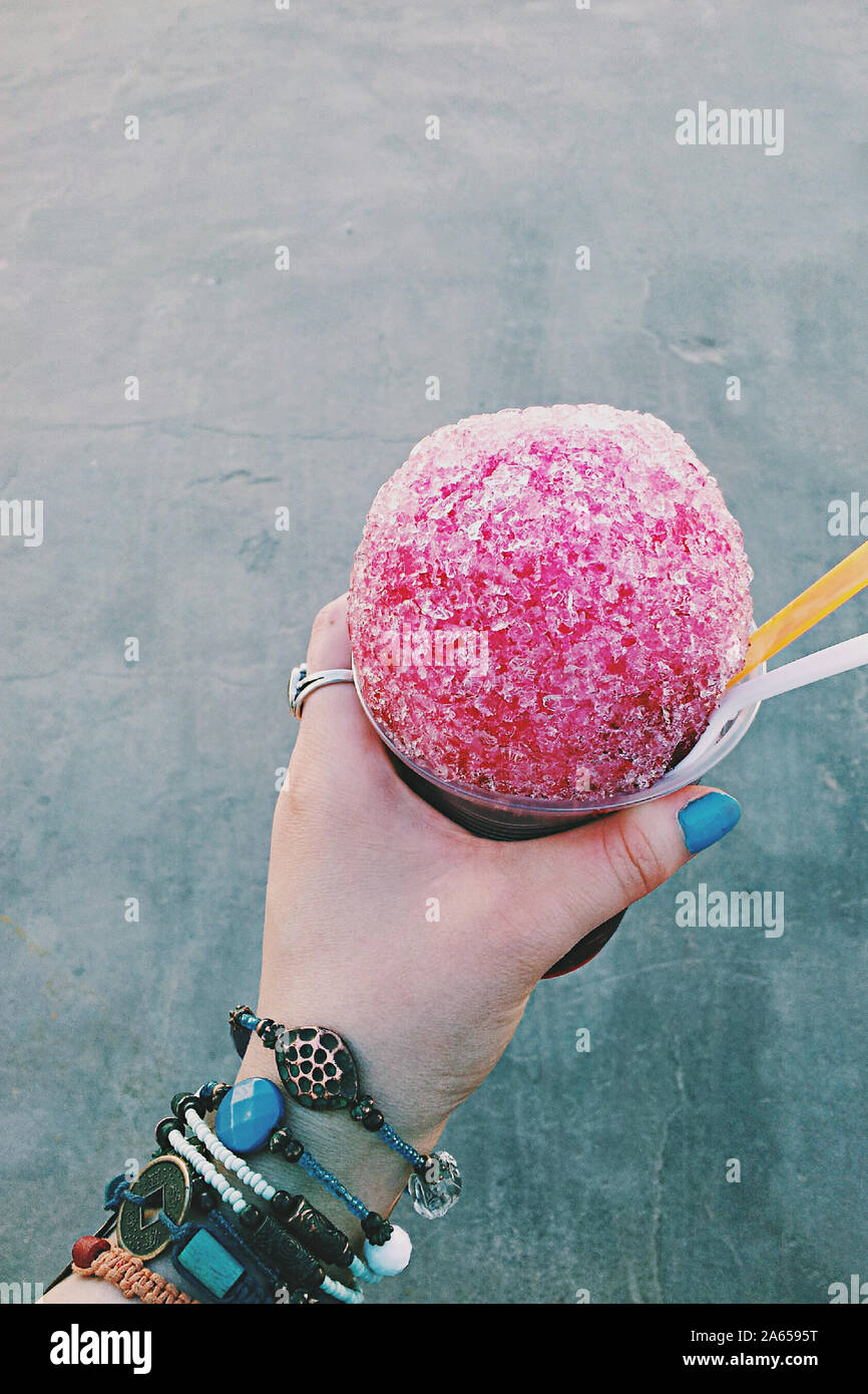 Woman holding a raspado ice beverage, Mexicali, Baja California, Mexico ...