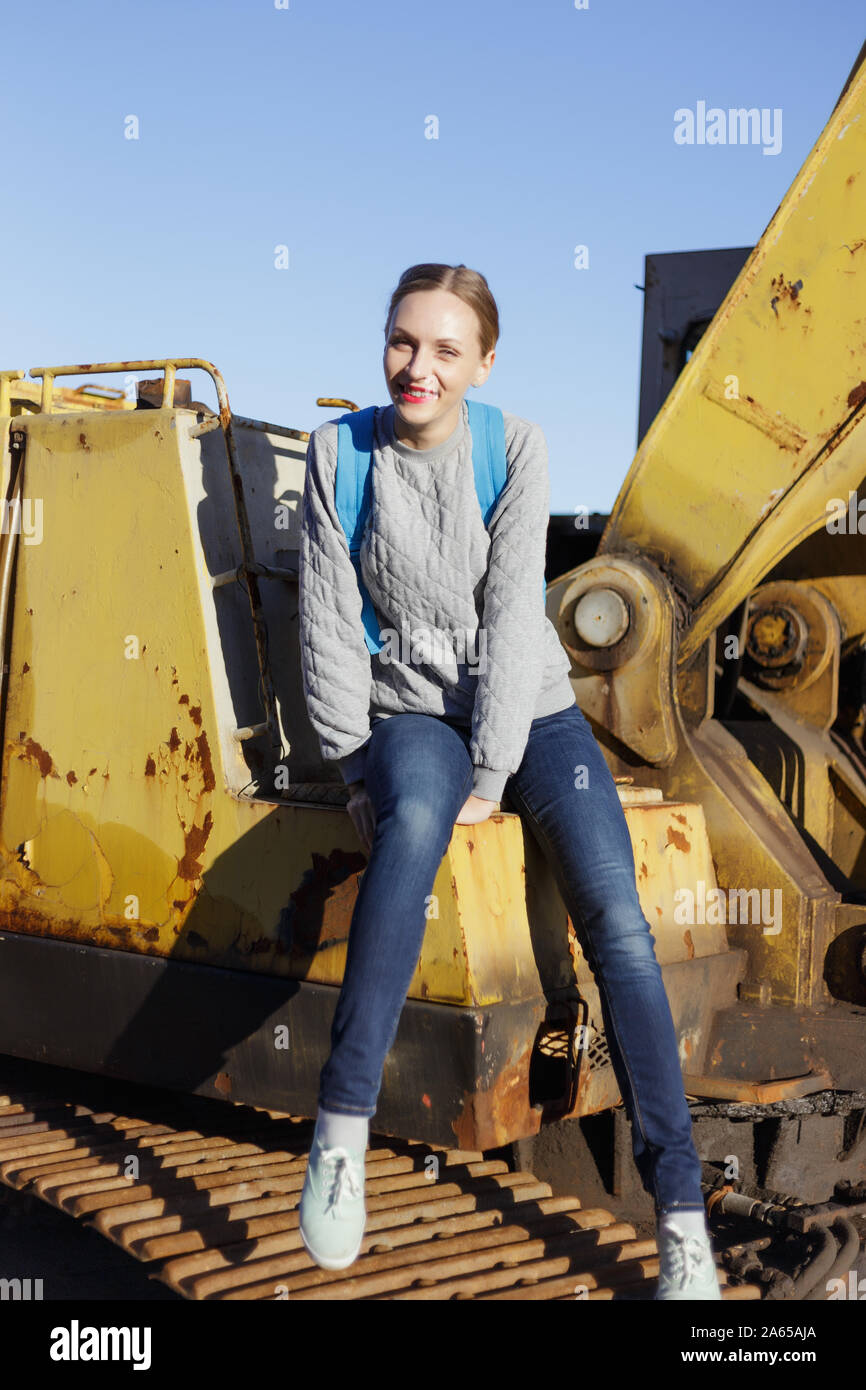 Young woman sitting on construction site hi-res stock photography and ...