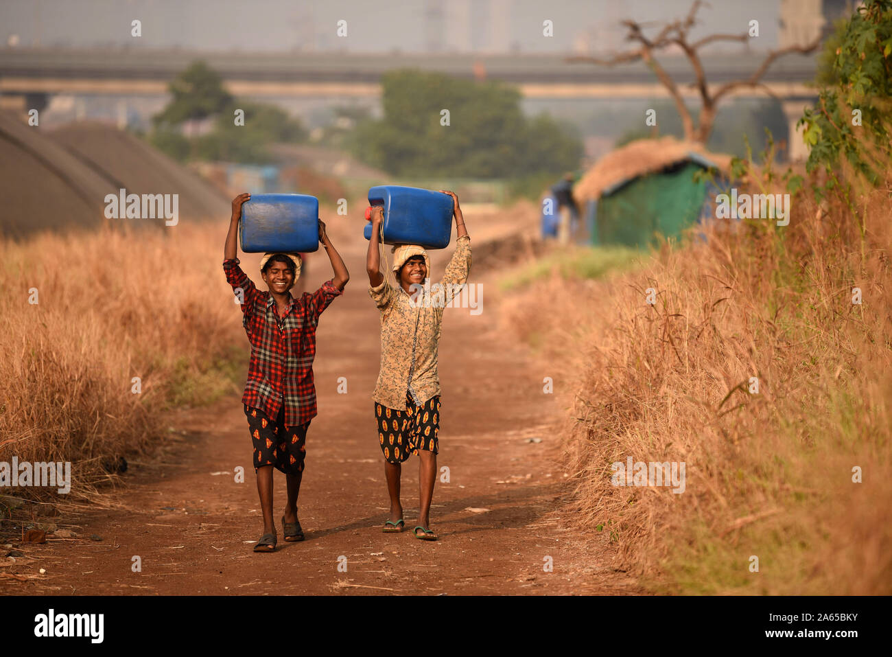 Man carrying plastic containers hi-res stock photography and images - Alamy