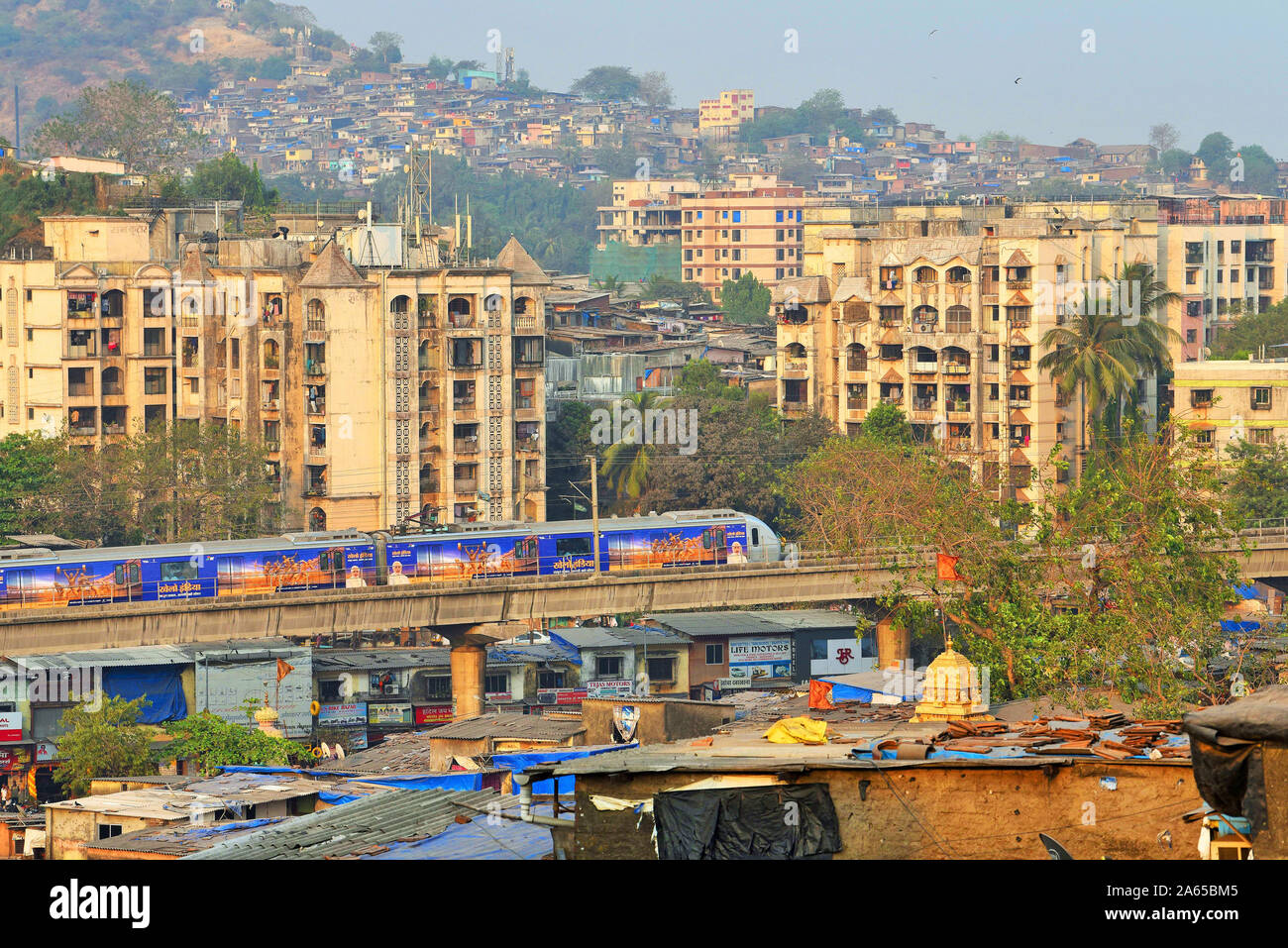 Metro train near Asalpha railway station, Bombay, Mumbai, Maharashtra ...