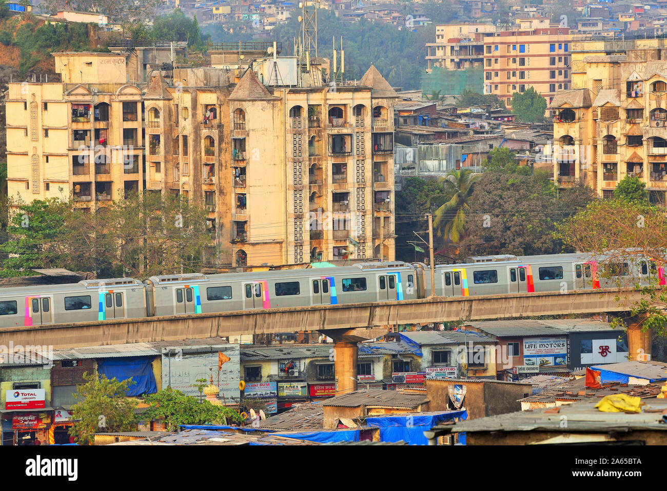 Metro train near Asalpha railway station, Bombay, Mumbai, Maharashtra ...