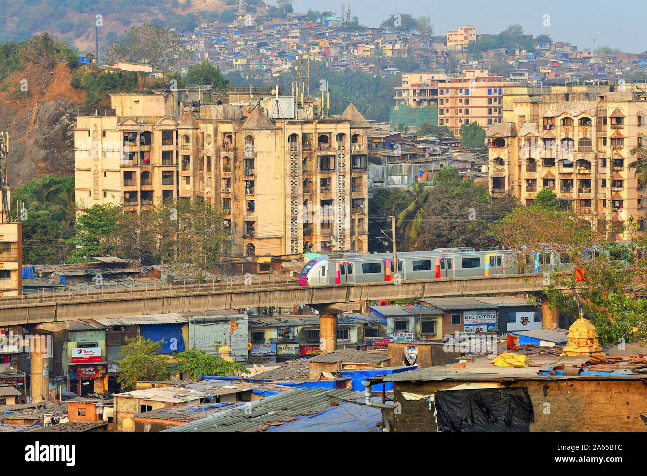 Metro train near Asalpha railway station, Bombay, Mumbai, Maharashtra ...