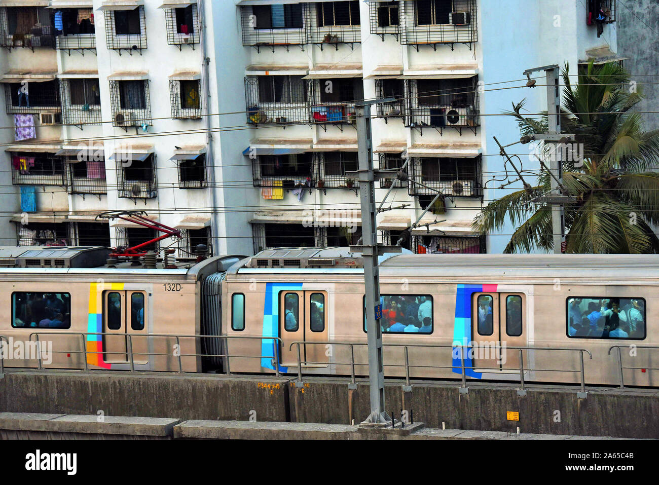 Metro train near Asalpha railway station, Bombay, Mumbai, Maharashtra ...