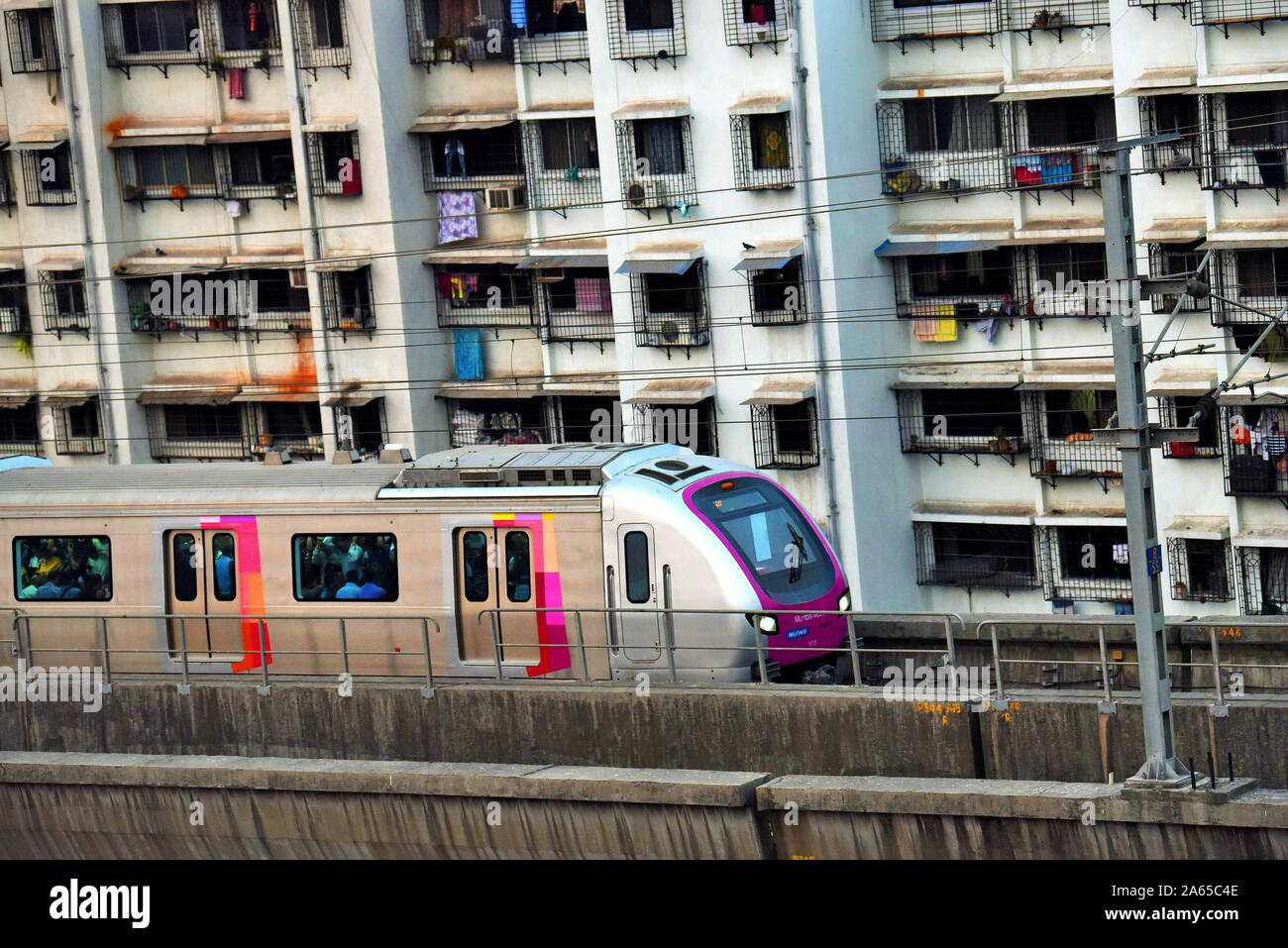 Metro train near Asalpha railway station, Bombay, Mumbai, Maharashtra ...