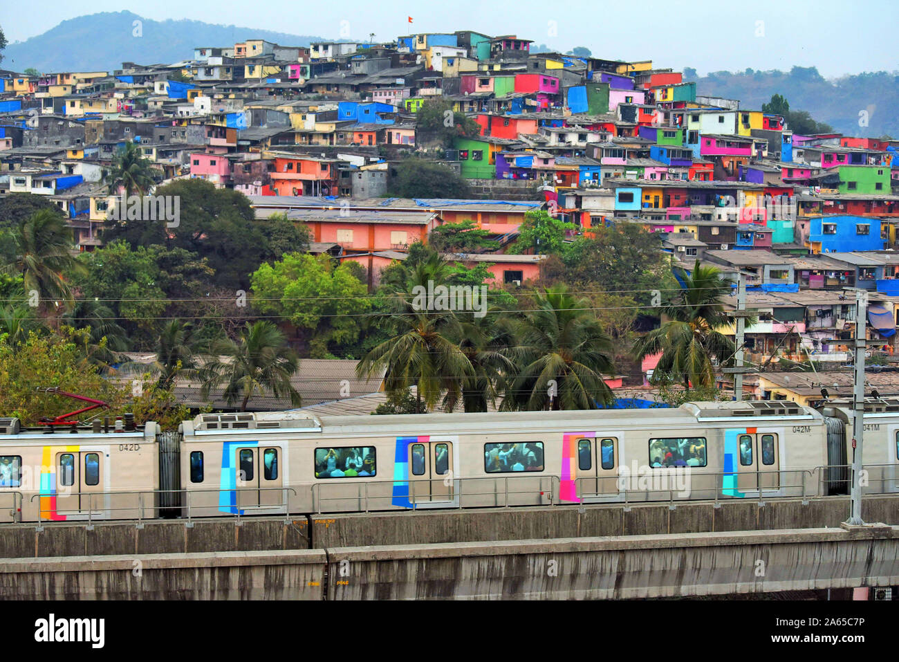 Metro train near Asalpha railway station, Bombay, Mumbai, Maharashtra ...