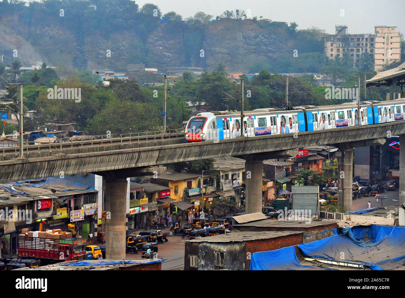Metro train near Asalpha railway station, Bombay, Mumbai, Maharashtra ...
