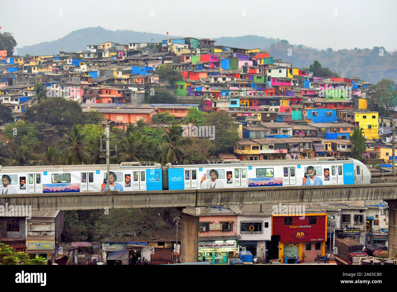Metro train near Asalpha railway station, Bombay, Mumbai, Maharashtra ...