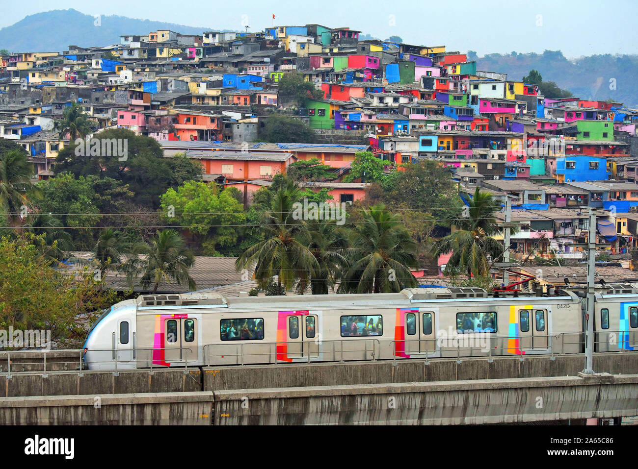 Metro train near Asalpha railway station, Bombay, Mumbai, Maharashtra ...