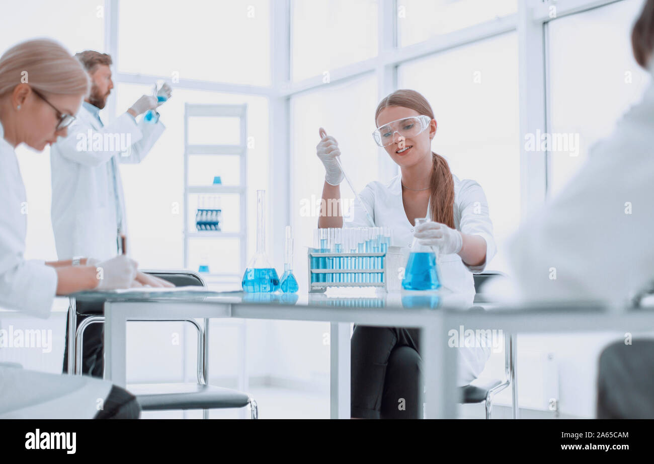 background image of young scientists in the laboratory Stock Photo - Alamy