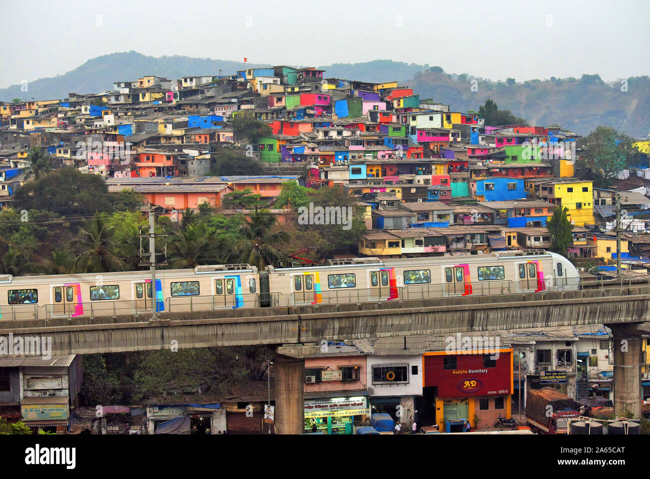 Metro train near Asalpha railway station, Bombay, Mumbai, Maharashtra ...