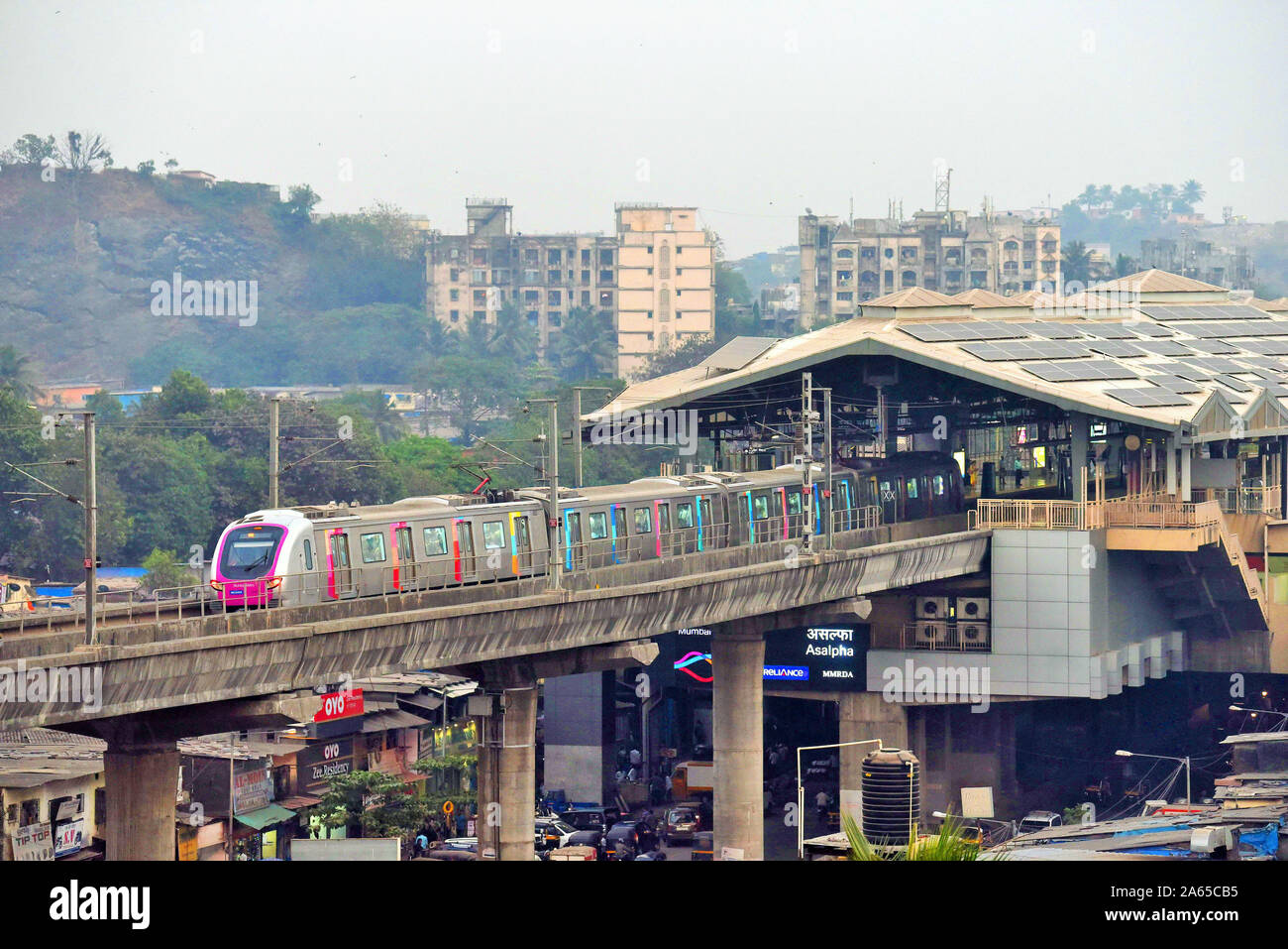 Metro train near Asalpha railway station, Bombay, Mumbai, Maharashtra ...