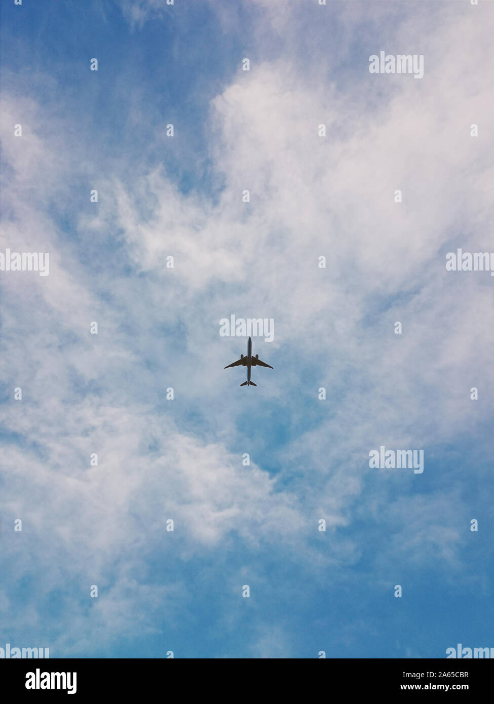 Low angle view of plane flying in sky Stock Photo - Alamy