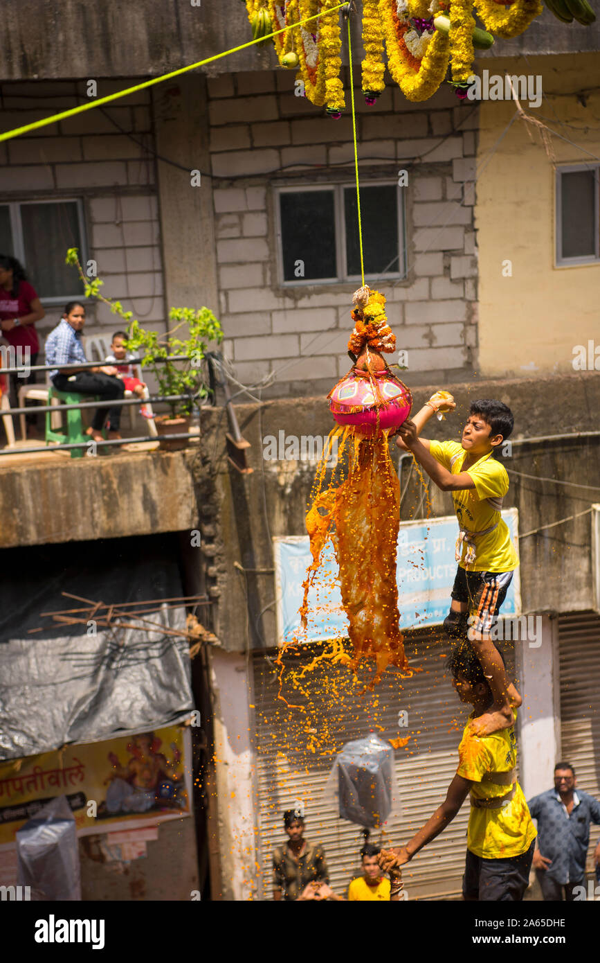 Men human pyramid breaking Dahi Handi, Janmashtami festival, Mumbai ...