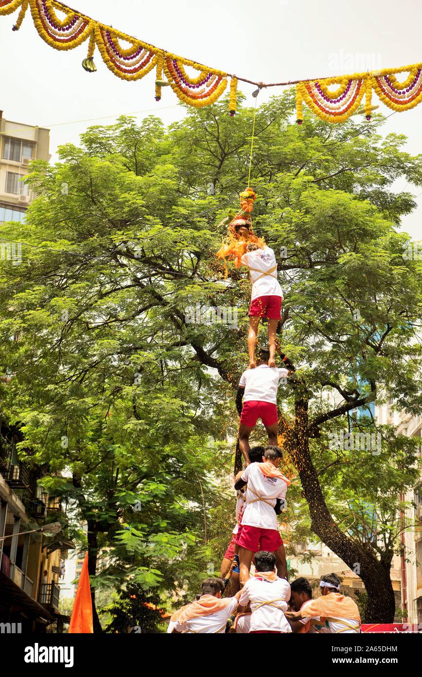 Men human pyramid breaking Dahi Handi, Janmashtami festival, Mumbai ...