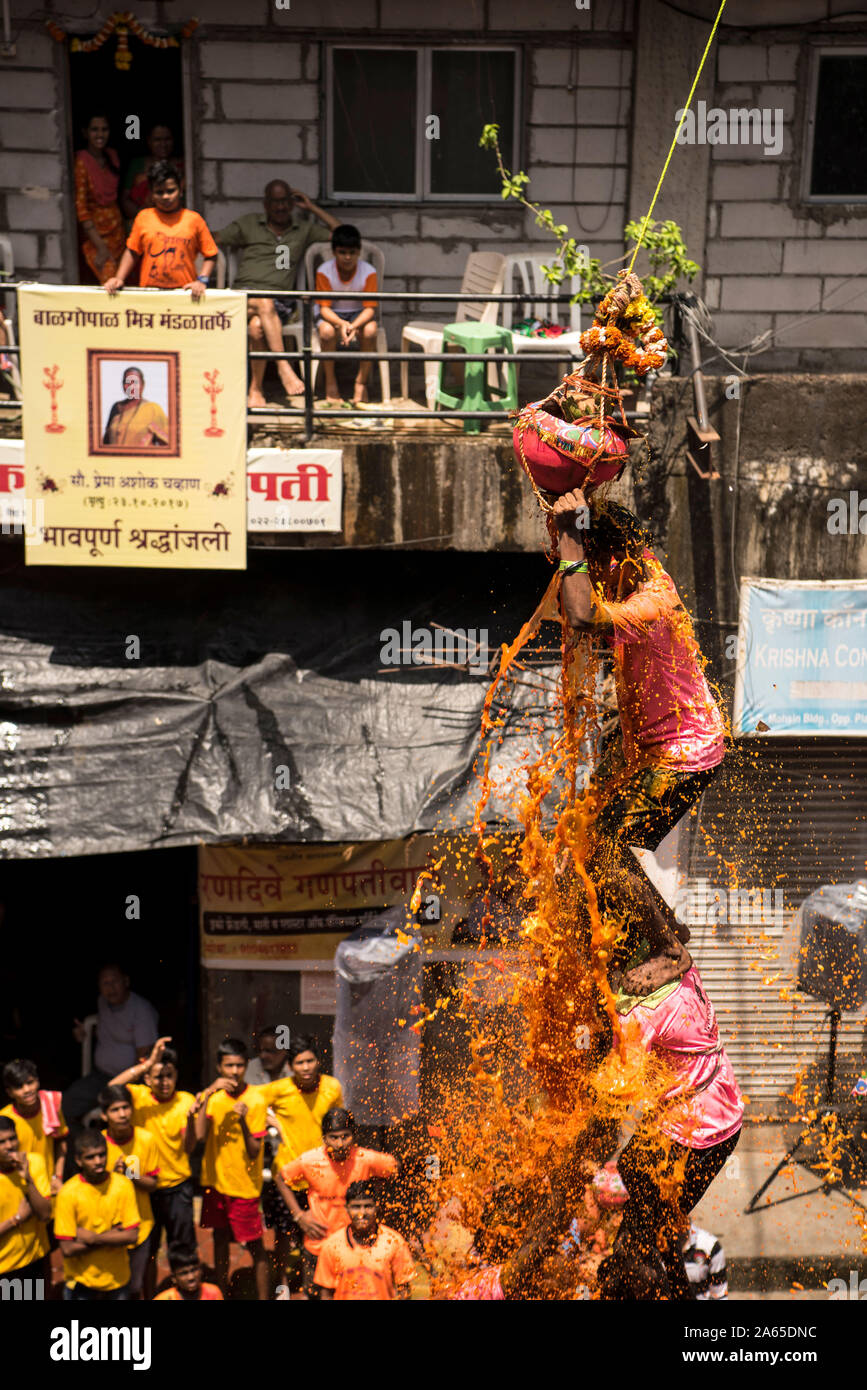 Men human pyramid breaking Dahi Handi, Janmashtami festival, Mumbai ...
