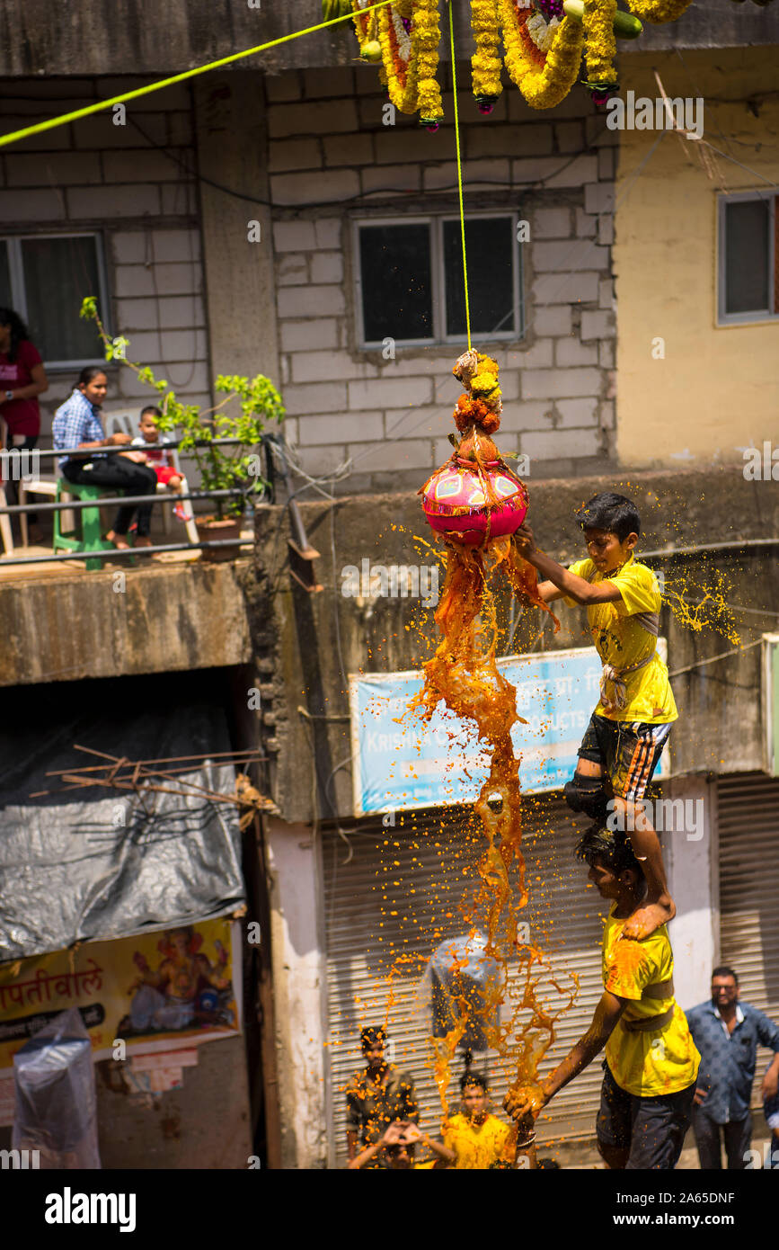 Men human pyramid breaking Dahi Handi, Janmashtami festival, Mumbai ...