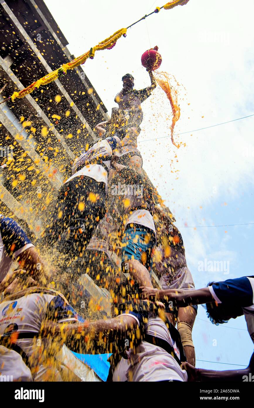 Men human pyramid breaking Dahi Handi, Janmashtami festival, Mumbai ...