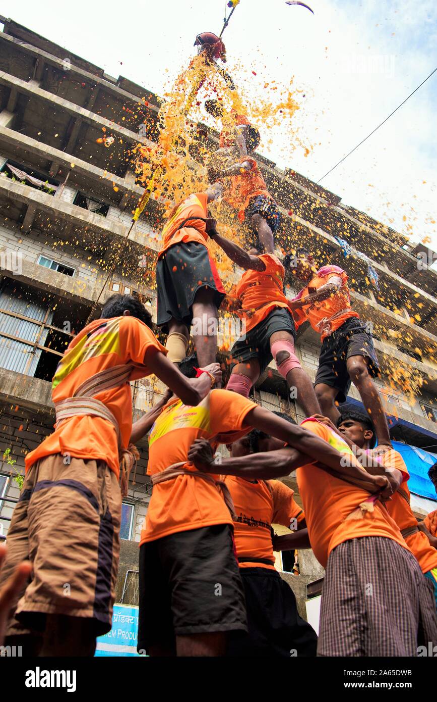Men human pyramid breaking Dahi Handi, Janmashtami festival, Mumbai ...