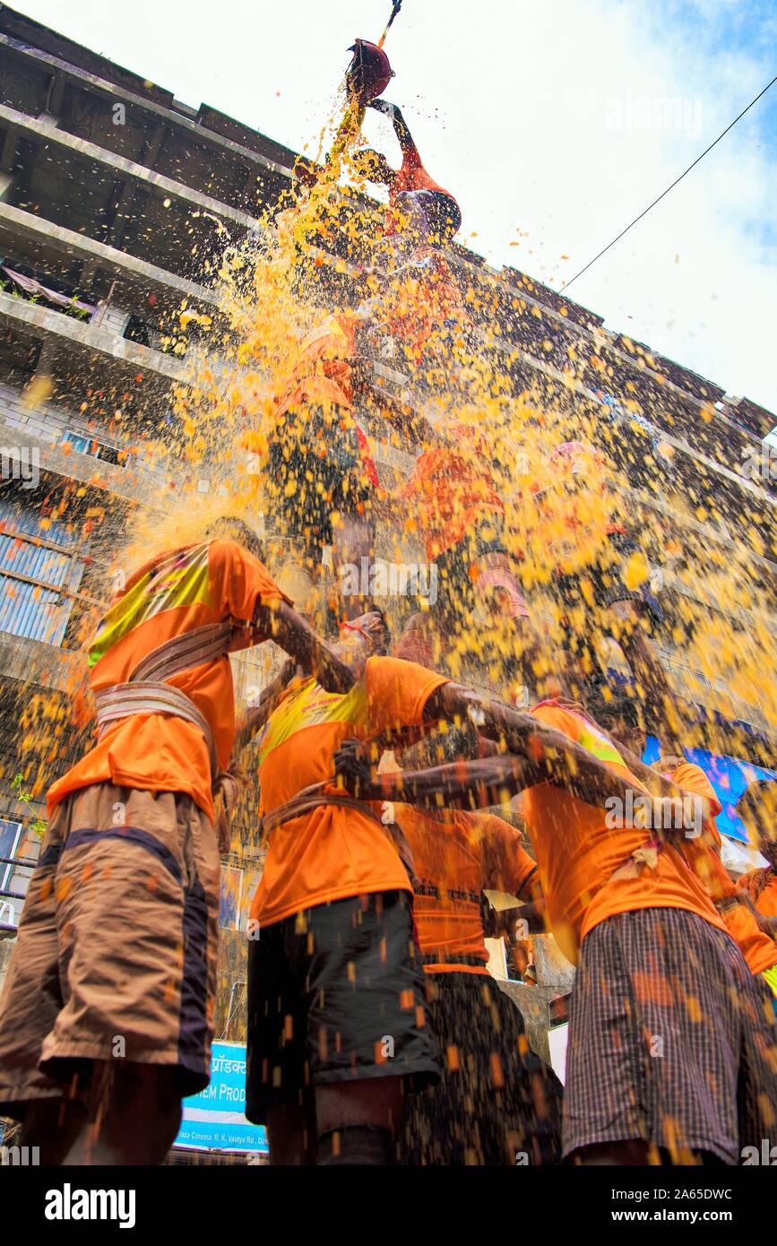 Men human pyramid breaking Dahi Handi, Janmashtami festival, Mumbai ...