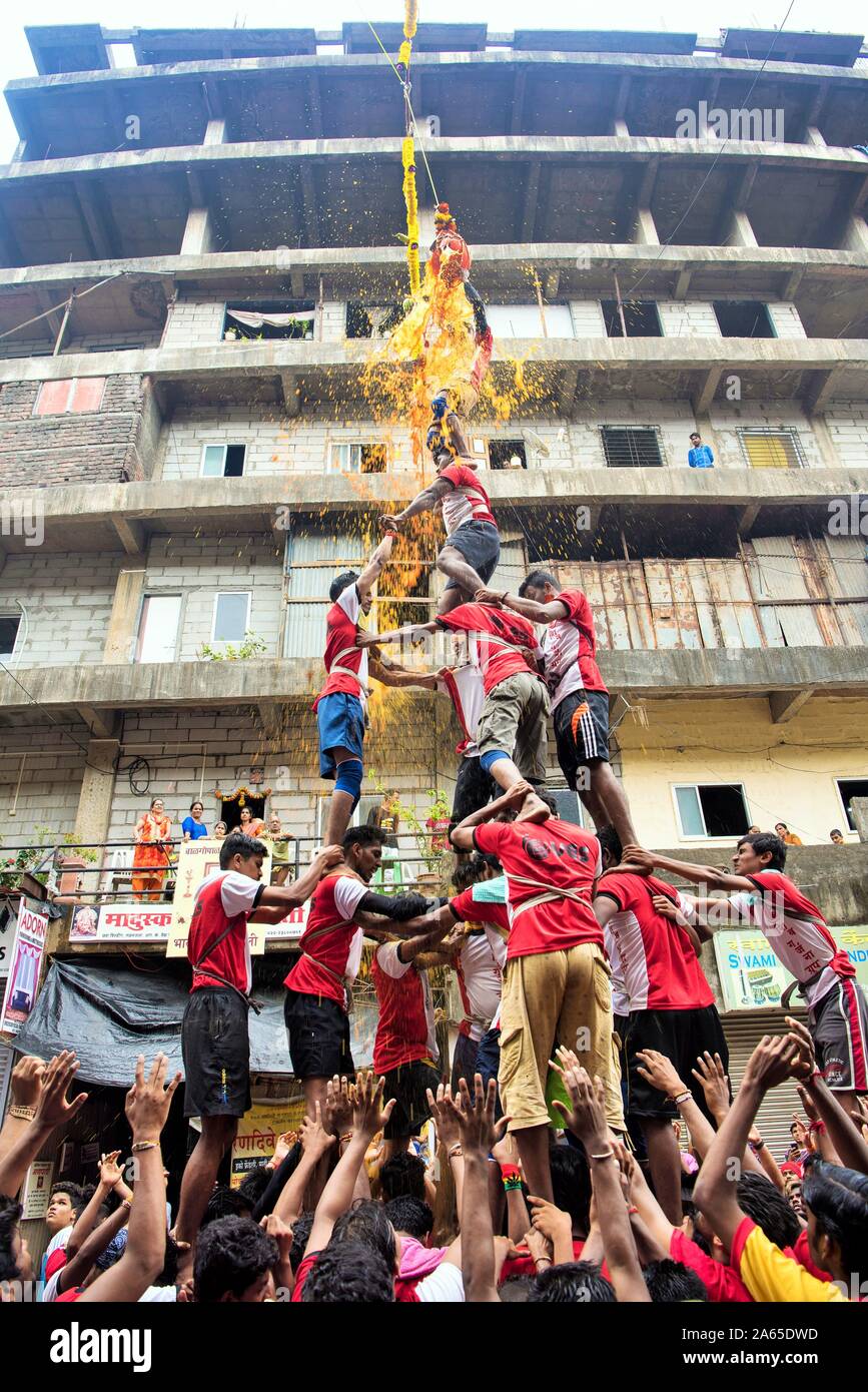 Men human pyramid breaking Dahi Handi, Janmashtami festival, Mumbai ...