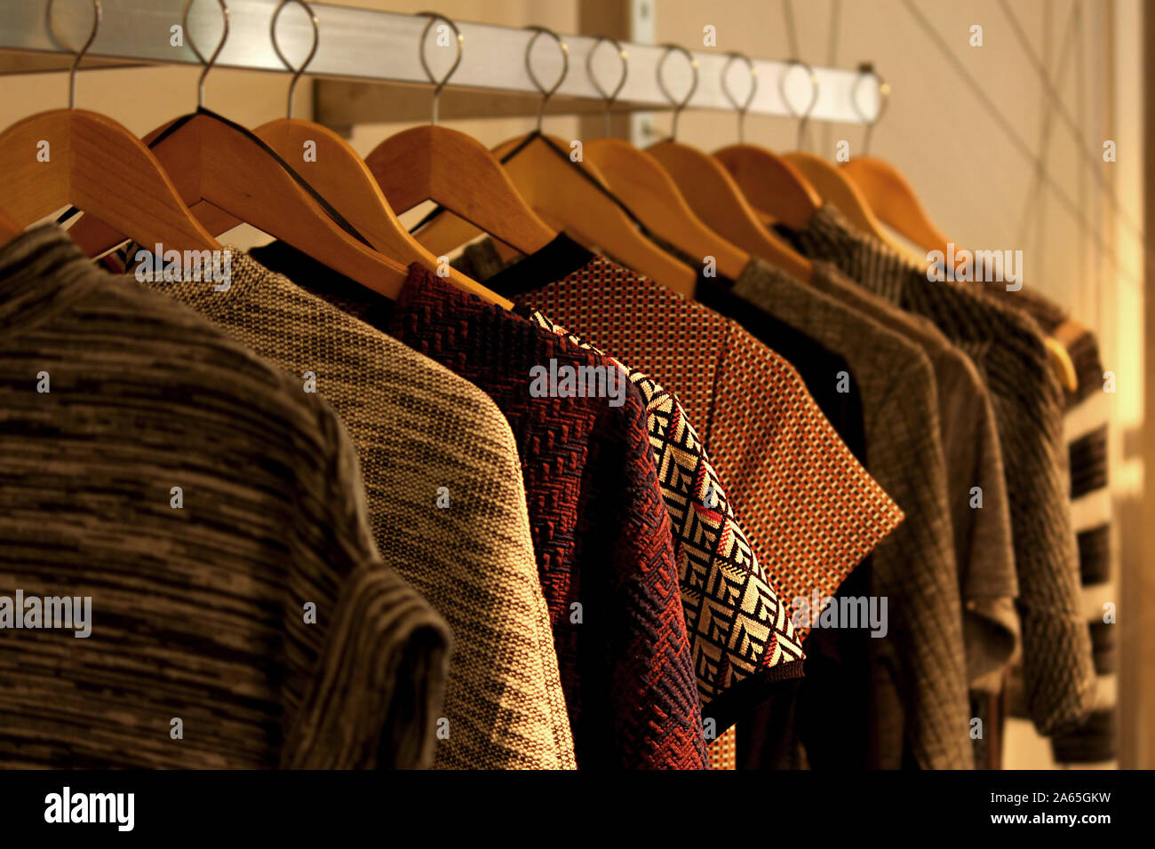 artwork of the show room with men's regalia full of summer dresses ...