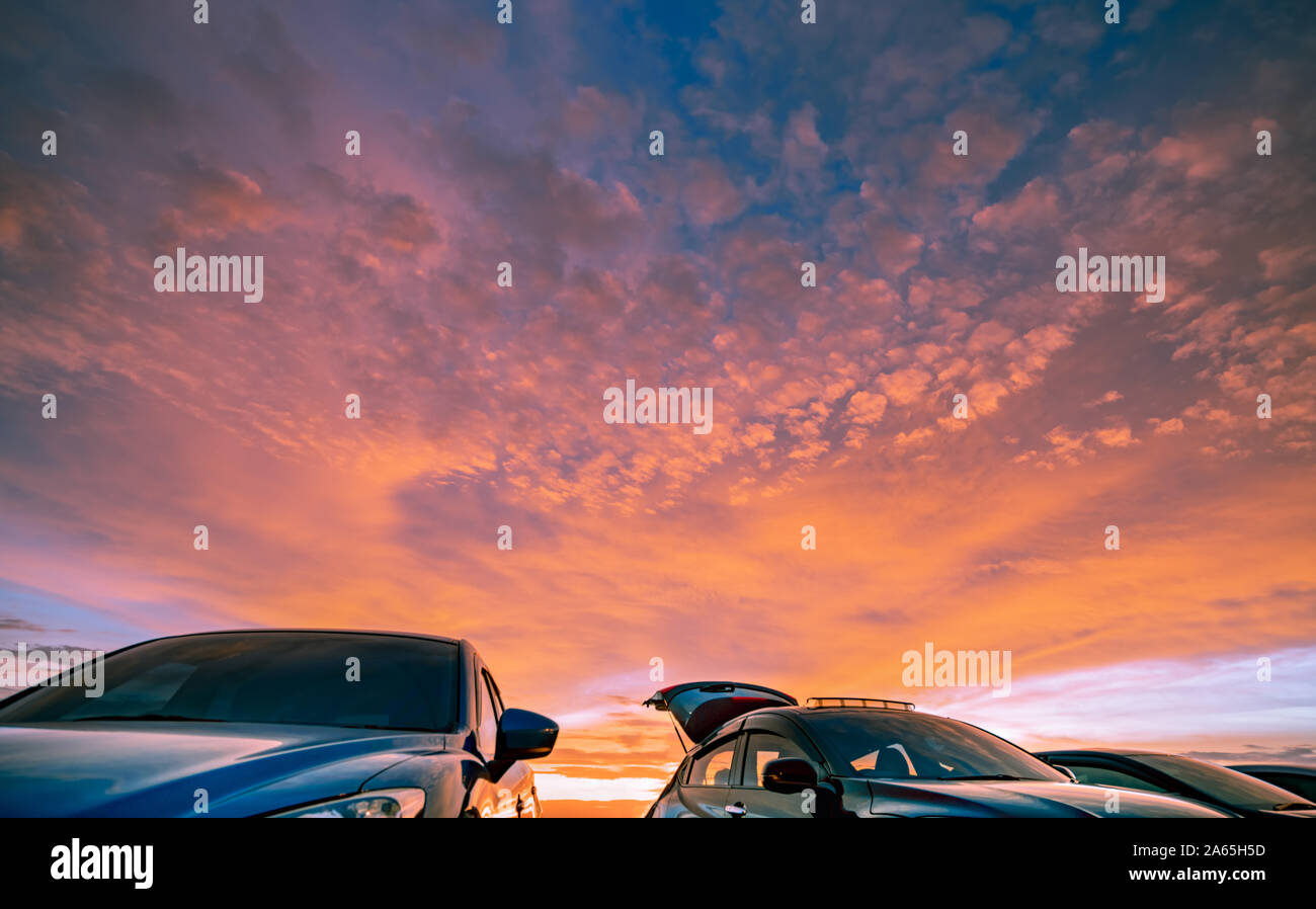 Car parked at outdoor car parking lot of campsite with beautiful sunset ...