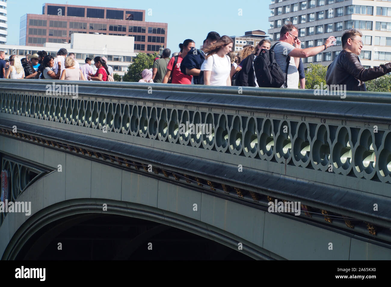 A view of pedestrians and sightseers on Westminster bridge, London ...
