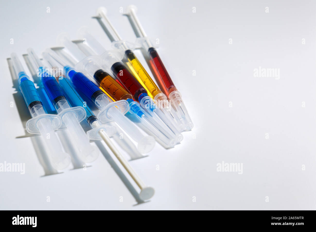 Medical syringes with colorful injections for cosmetology. Syringes ...