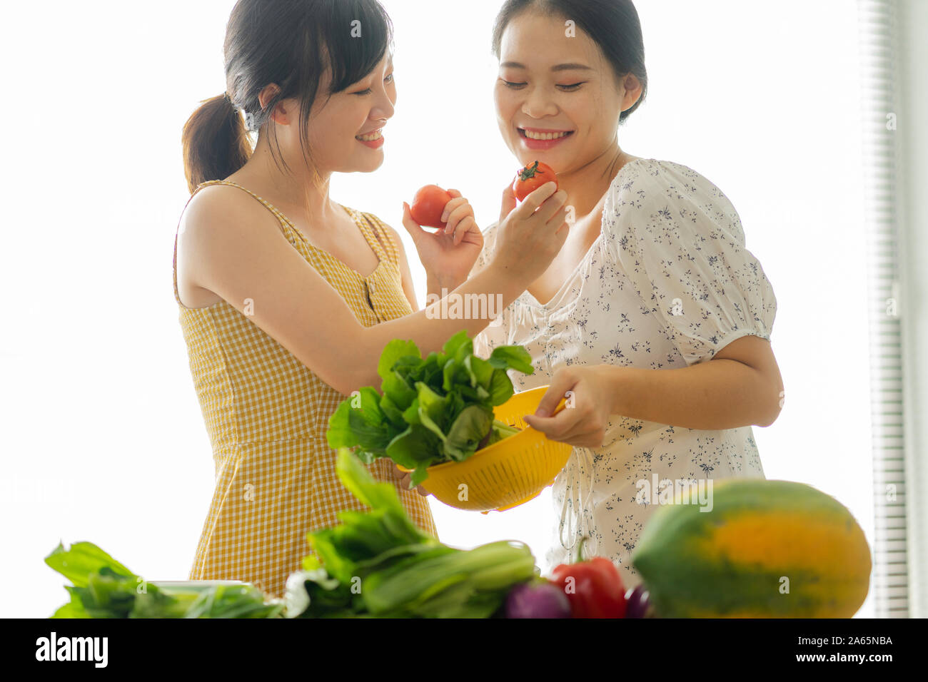 Pretty girls cooking in the kitchen Stock Photo - Alamy