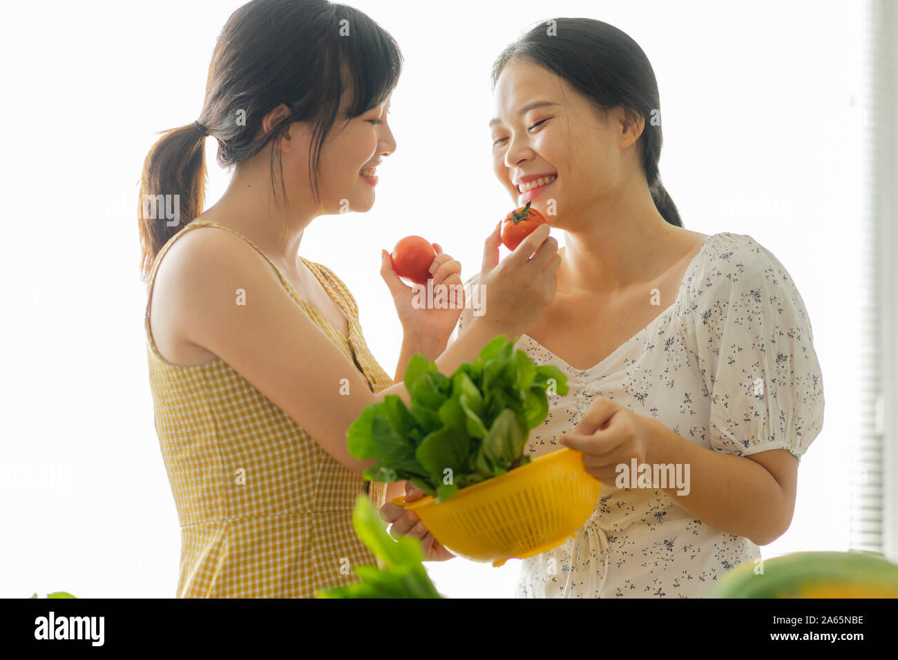 Pretty girls cooking in the kitchen Stock Photo - Alamy