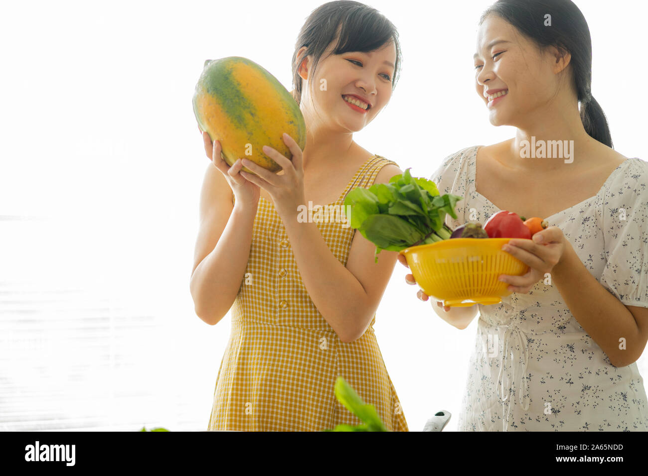 Pretty girls cooking in the kitchen Stock Photo - Alamy