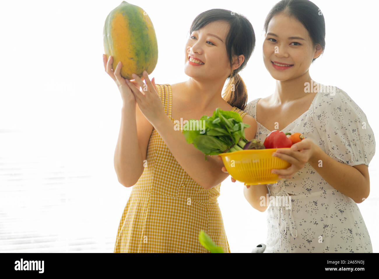 Pretty girls cooking in the kitchen Stock Photo - Alamy